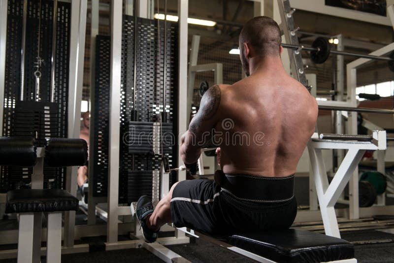 Back Exercises on a Seated Row Machine Stock Photo - Image of human ...