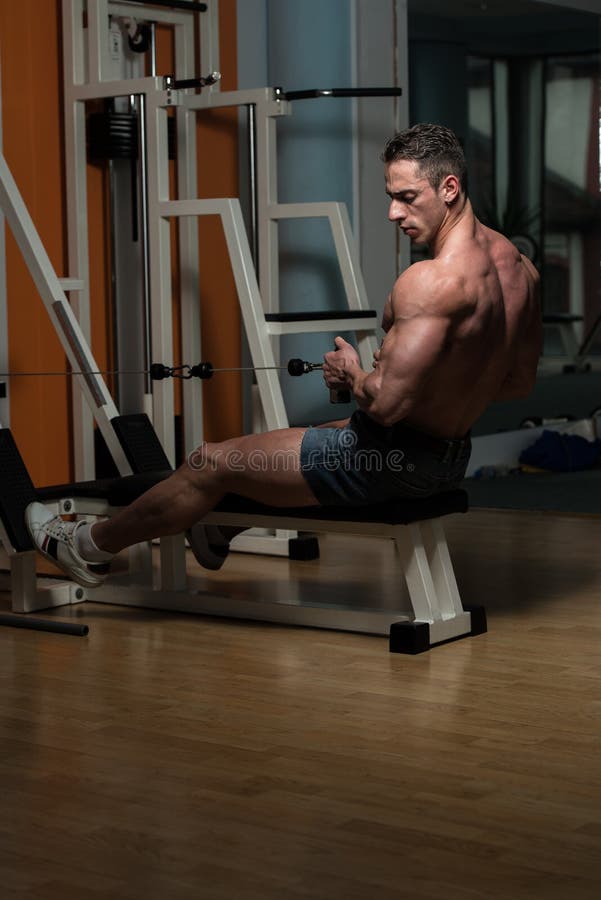 Back Exercises on a Seated Row Machine Stock Photo - Image of body ...