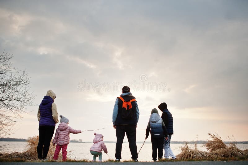Back of Family with Four Kids on the Shore of the Lake Stock Photo ...