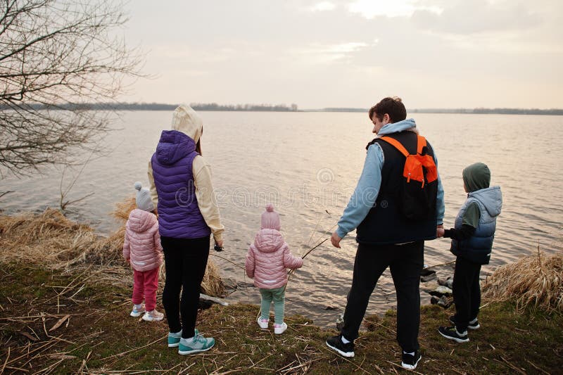 Back of Family with Three Kids on the Shore of the Lake Stock Image ...