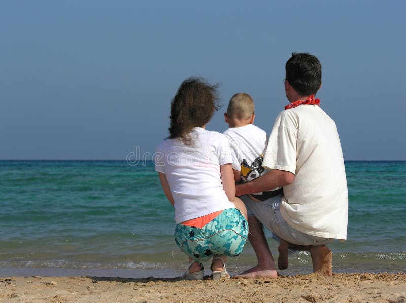 Back Family of Three Sit on Beach Stock Image - Image of blue, face: 489301