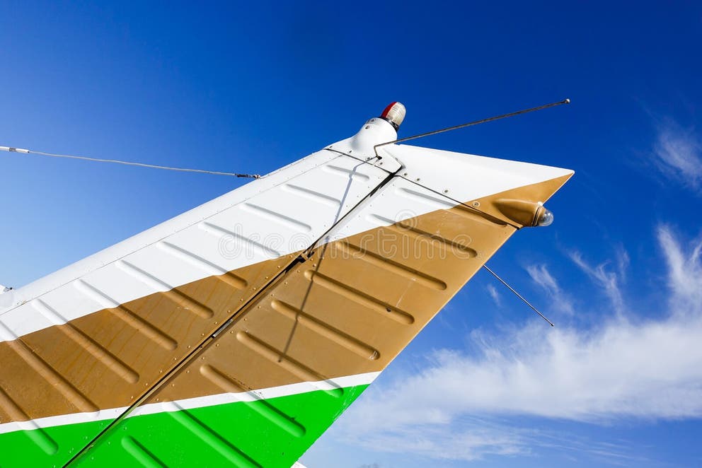 The Back of the Fuselage of a Light-engine Aircraft Against the Sky ...