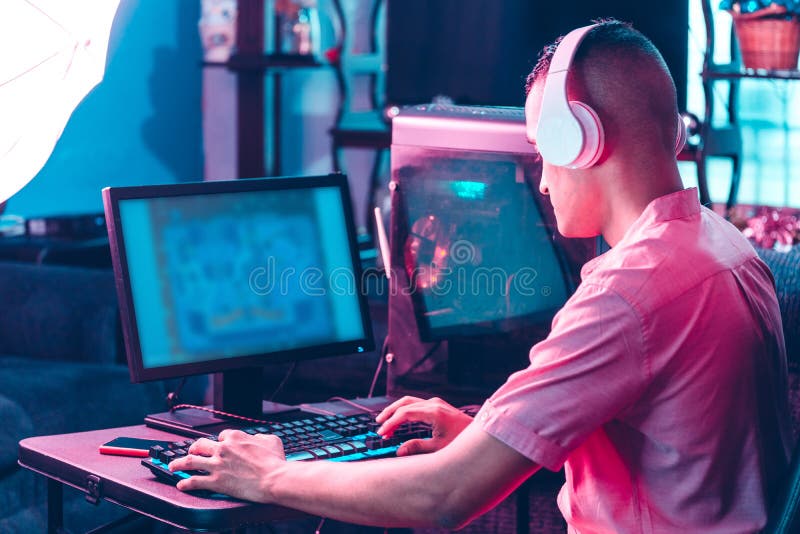Back of Gamer Playing a Video Game on a Computer Stock Photo - Image of ...