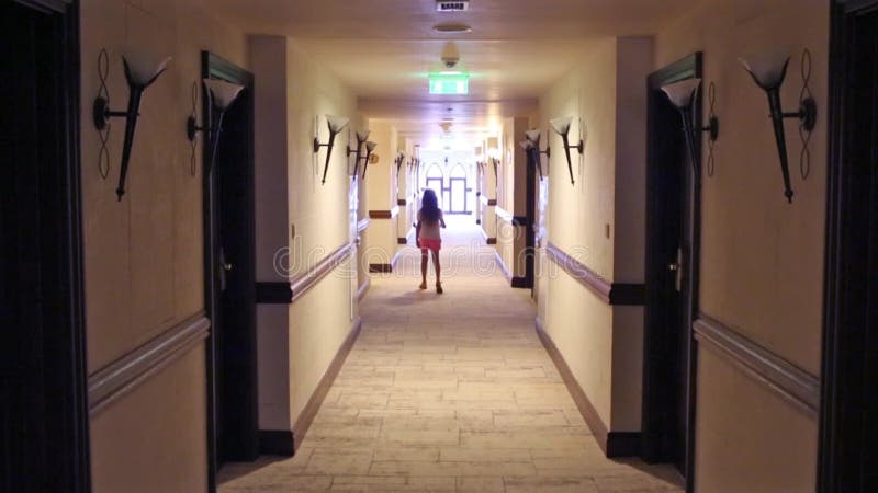 Back of Girl in Shorts Going in Hallway in Modern Stock Video - Video ...