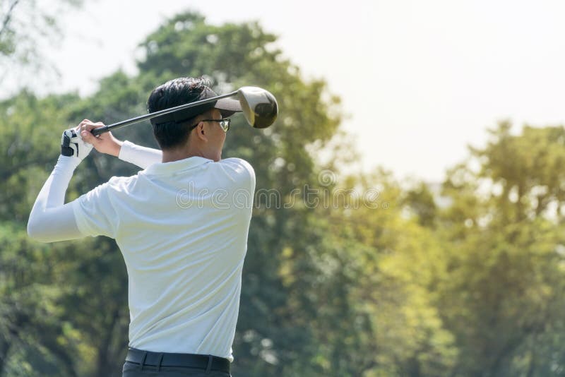 Golf Player in White Shirt Swinging Glof. Young Man Practicing His ...