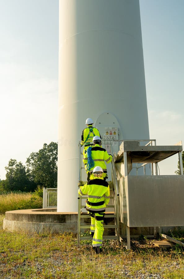 Group of Wind Turbines on Green Hillside Stock Photo - Image of hilltop ...