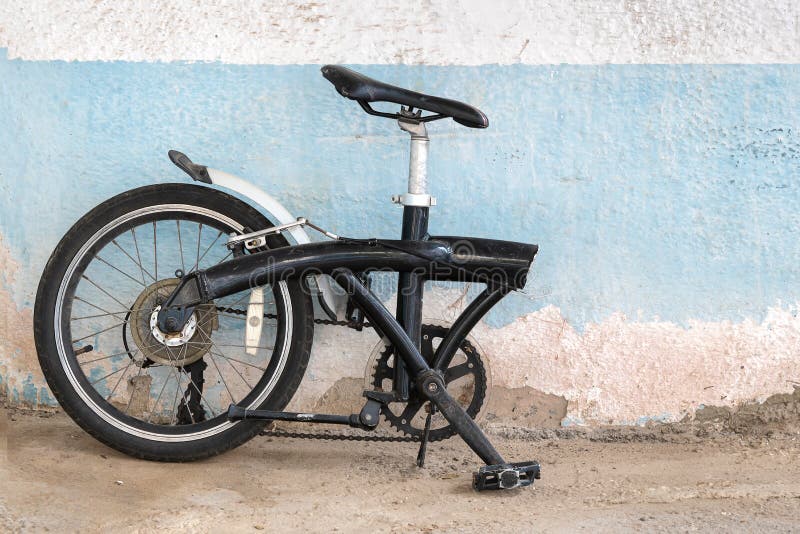 The Back Half of a Bicycle Broken into Two Parts Against the Wall Stock ...