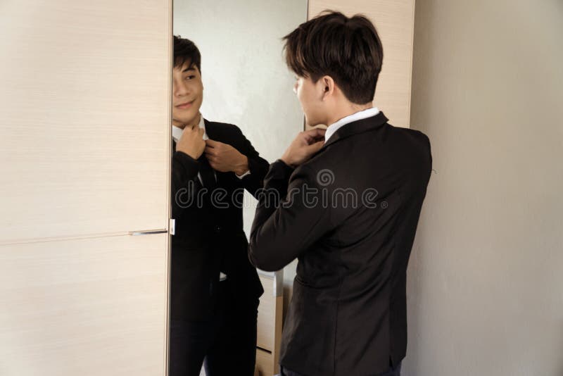 Handsome Man Dressing Up in Front of of the Mirror Stock Photo - Image ...