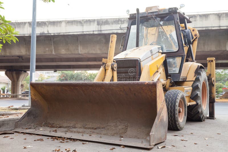 Back Hoe still on road stock image. Image of tractor - 88707621