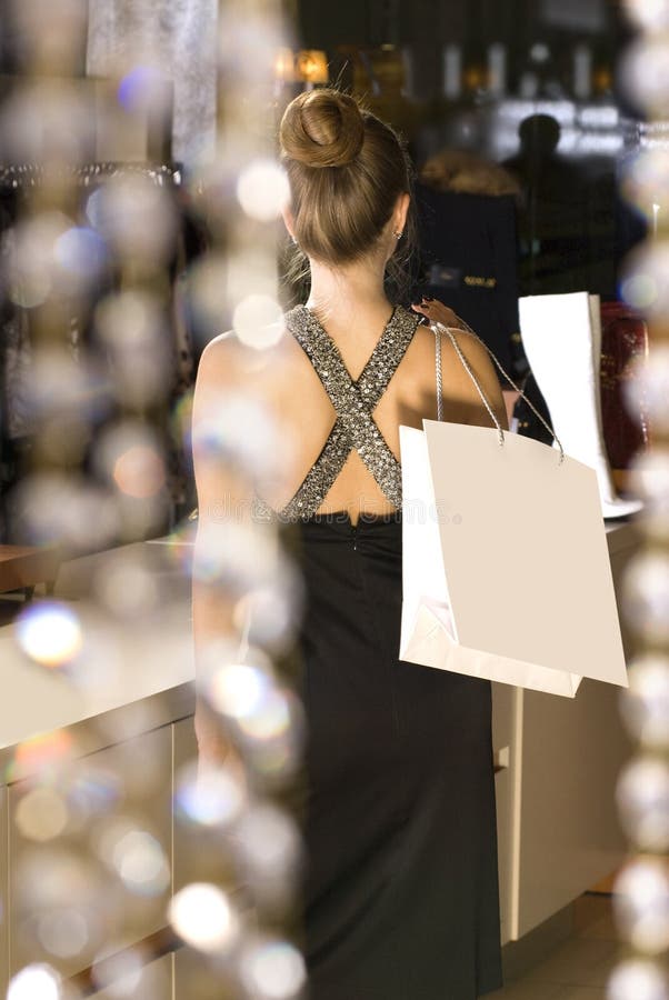 Back of Lady in the Boutique Stock Image - Image of female, choose ...