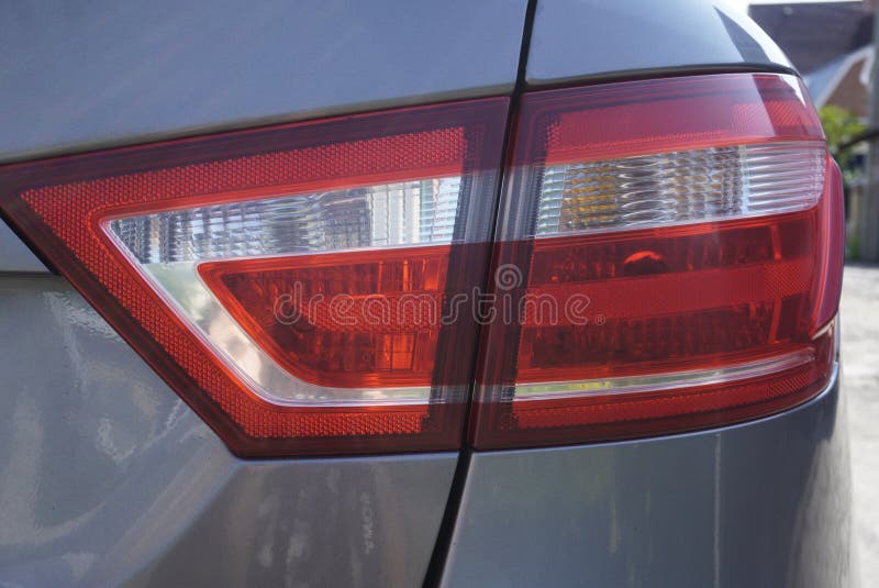 Back Lights of Grey Car, while Flaming Red. Russian Car Stock Photo ...