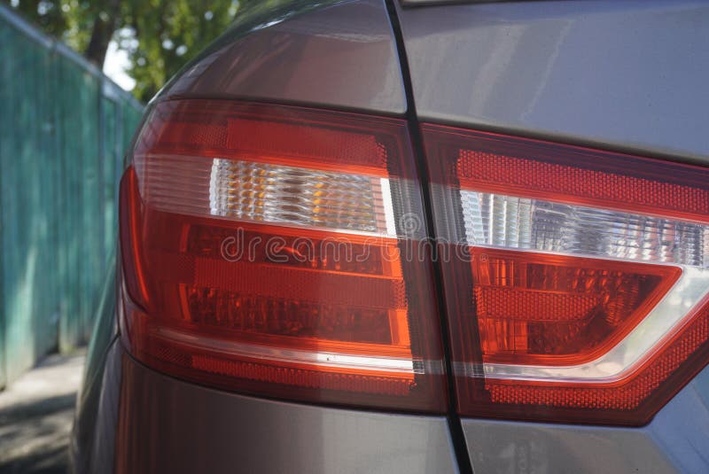 Back Lights of Grey Car, while Flaming Red. Russian Car Stock Photo ...
