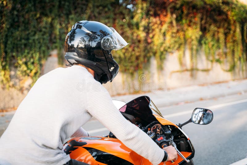 Back of a Man in a Helmet Driving a Motorcycle Stock Photo - Image of ...