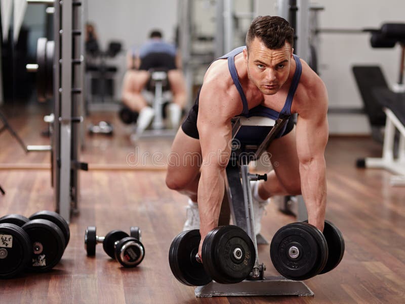 Back muscles workout stock image. Image of handsome, dumbbell - 39983085