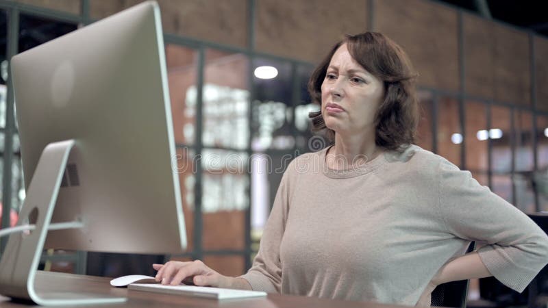 Back Pain, Uncomfortable Old Woman Working on Computer Stock Footage ...