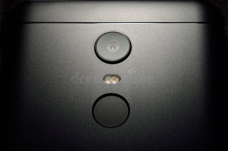 Back Panel and Smartphone Camera in the Dark, Close Up Stock Photo ...