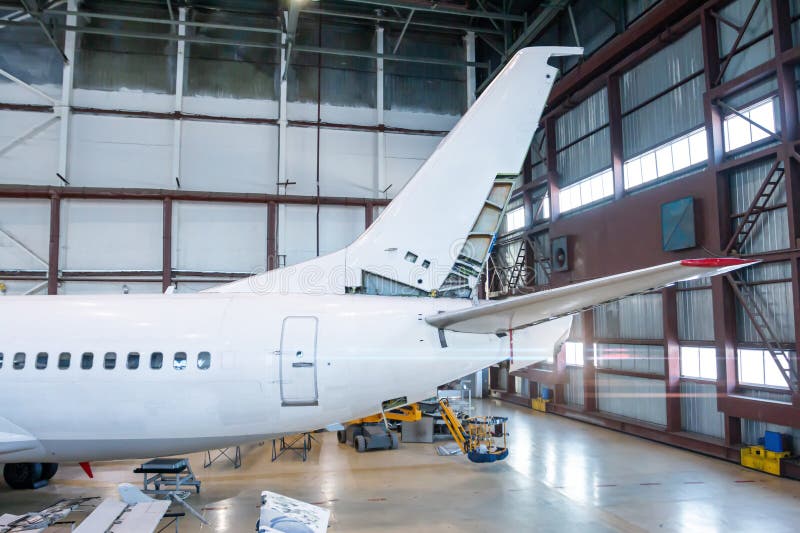 The Back of a Passenger Airplane Under Maintenance in the Hangar Stock ...