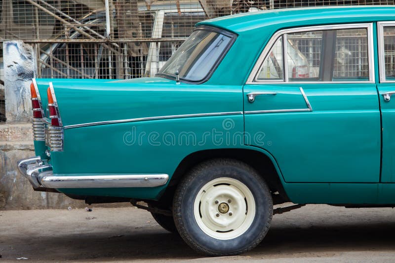 Back or Rear Half of a Vintage Car Parked Outside a Repair Work Stock ...