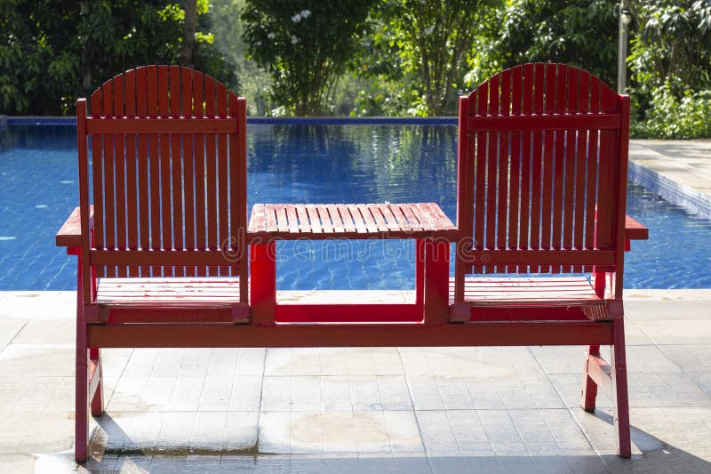 The Back of Red Couple Chair with Middle Table Rests by the Pool. Stock ...