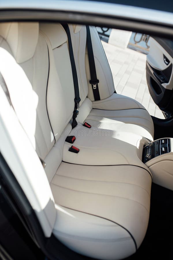 The Back Seat of a Premium Car. Beige Leather and Control System Stock ...