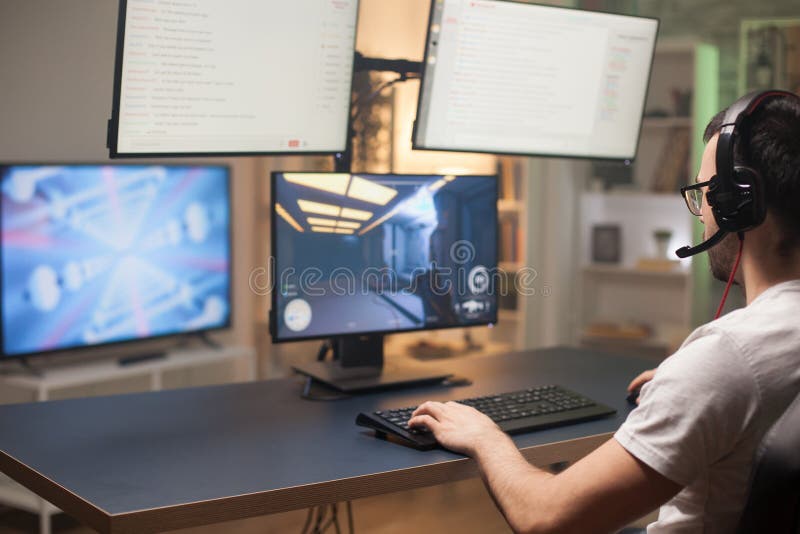 Back Shot of Man Playing Shooter Game Stock Image - Image of display ...