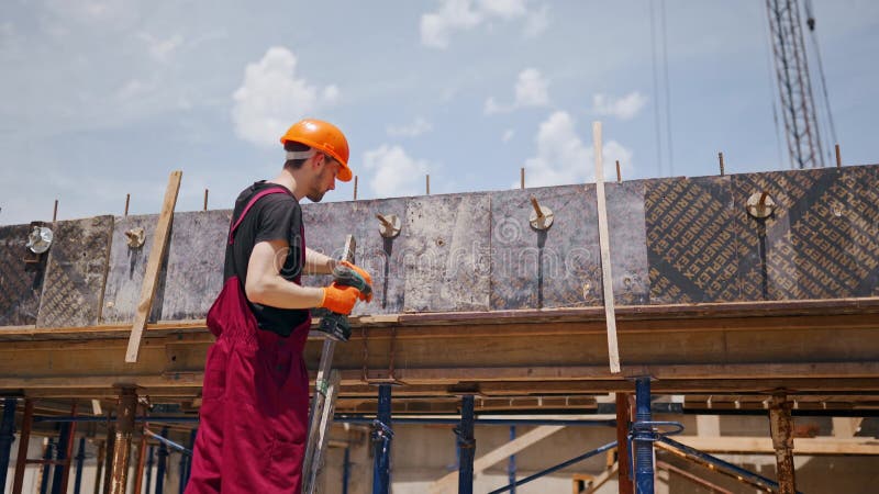 Back Shot of Professional Construction Worker in Hard Hat and Bib ...