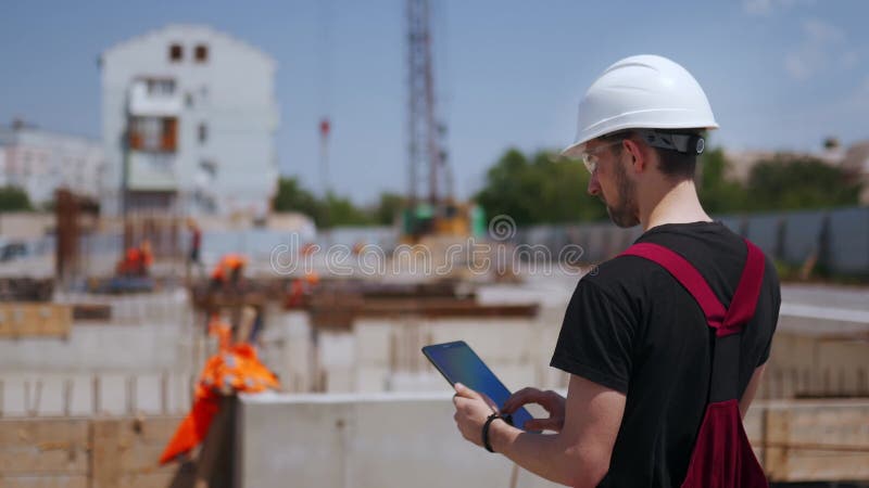 Side Shot of Professional Construction Worker Wearing Hard Hat Holds ...