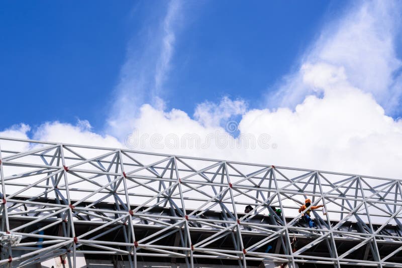 Back Side of Construction Workers are Working on Top of Building ...