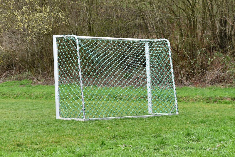 Back Side of Empty Soccer Goal with White Frame and Green Net Standing ...