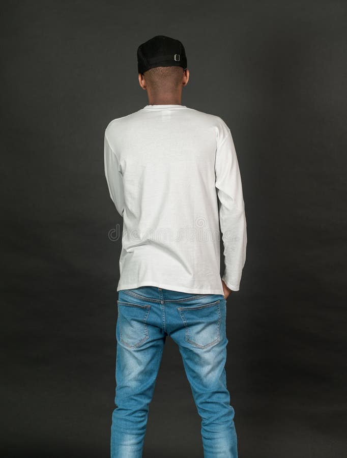 An African Man Wearing a White Blank Shirt Doing a Pose on the Black ...