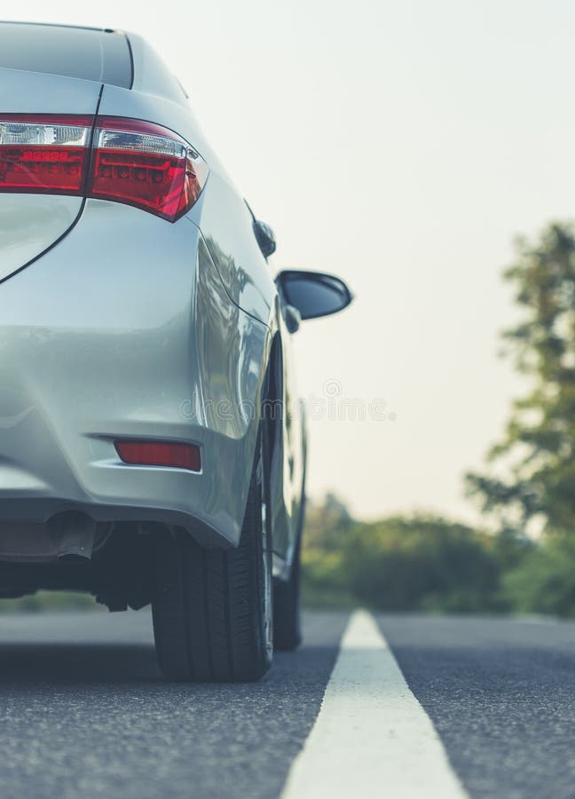 Back Side of New Silver Car Parking on the Asphalt Road Stock Photo ...