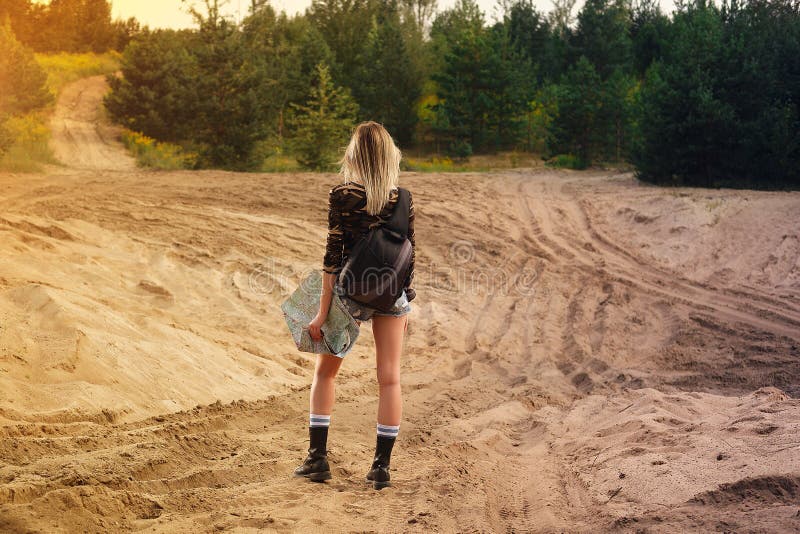 Back Side of Traveler Girl Searching Right Direction on Map Stock Photo ...