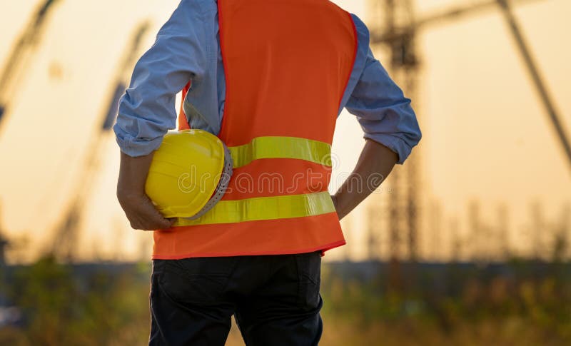 Back Side View of Man Holding White Helmet Close Up. Construction ...