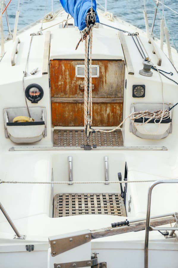 The Back of a Small White Yacht Moored with Folded Sails. Vertical ...