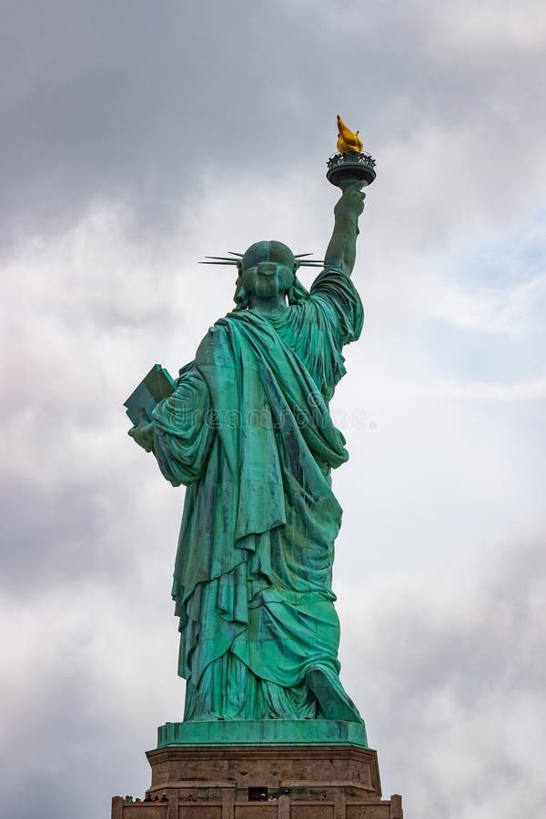 Back of Statue of Liberty on Cloudy Day Stock Photo - Image of building ...