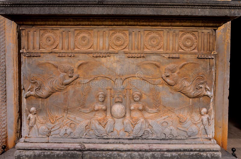 The Back of a Stone Wall with a Design of Angels and a Sphere Stock ...
