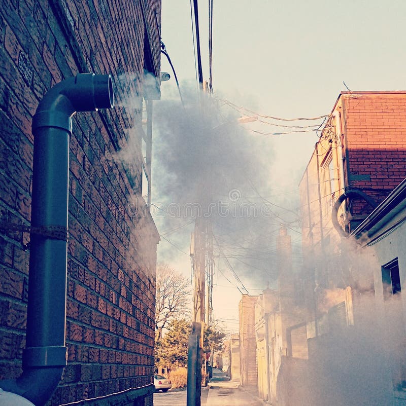 Back Street Smoke stock photo. Image of tower, street - 246901908