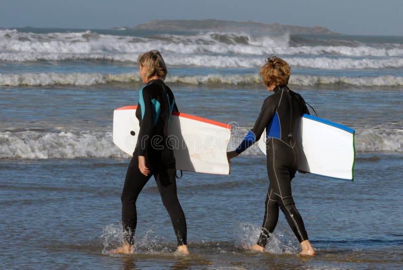 Back Surfers Going in the Ocean Editorial Photo - Image of holidays ...
