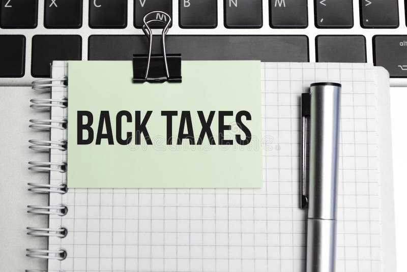 BACK TAXES Text and Notepad with Pen, Charts and Calculator Stock Photo ...