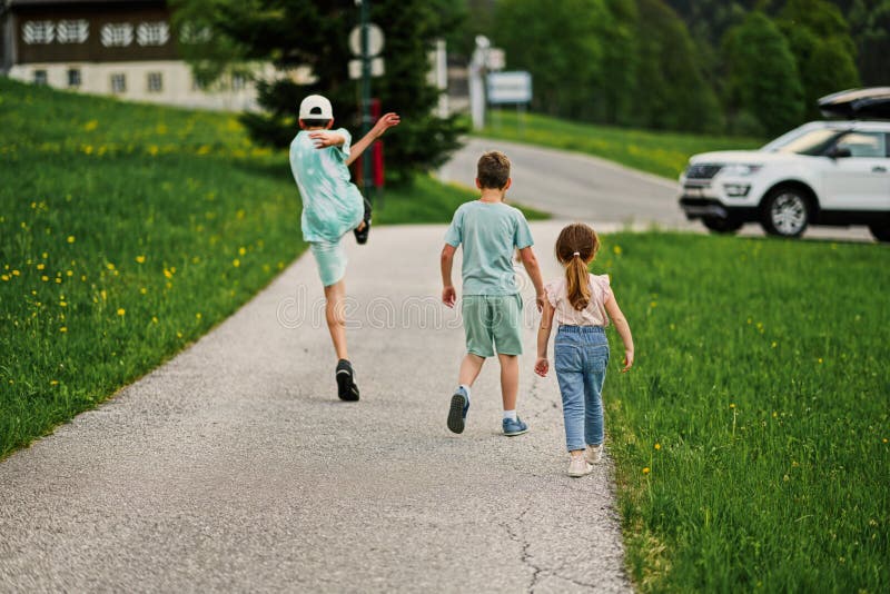 Back of Three Kids Walking at Untertauern, Austria Stock Photo - Image ...