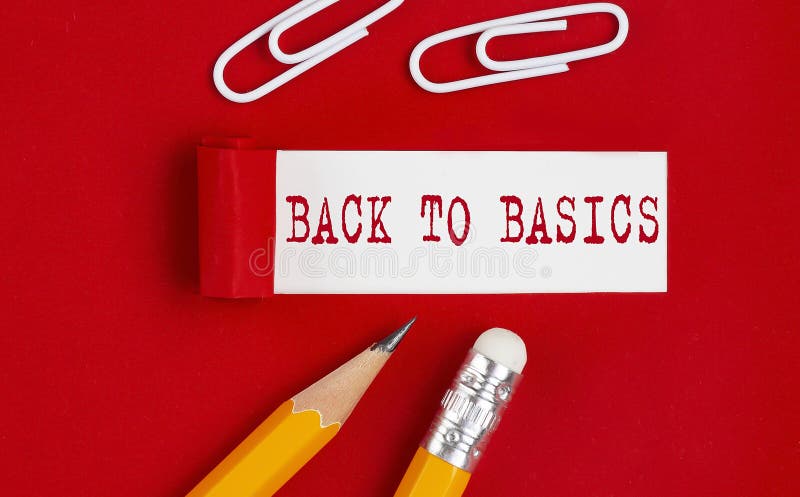 BACK TO BASICS Message Written on Torn Red Paper with Pencils and Clips ...