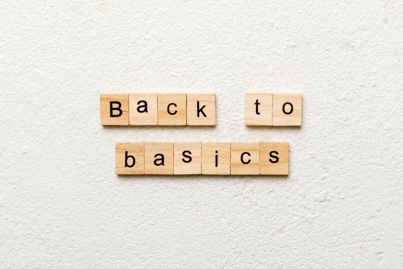 Back To Basics Word Written on Wood Block. Back To Basics Text on Table ...