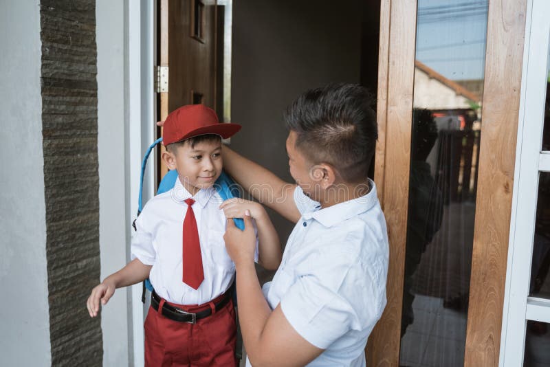 Asian Elementary Student Getting Ready for School with Father Stock ...