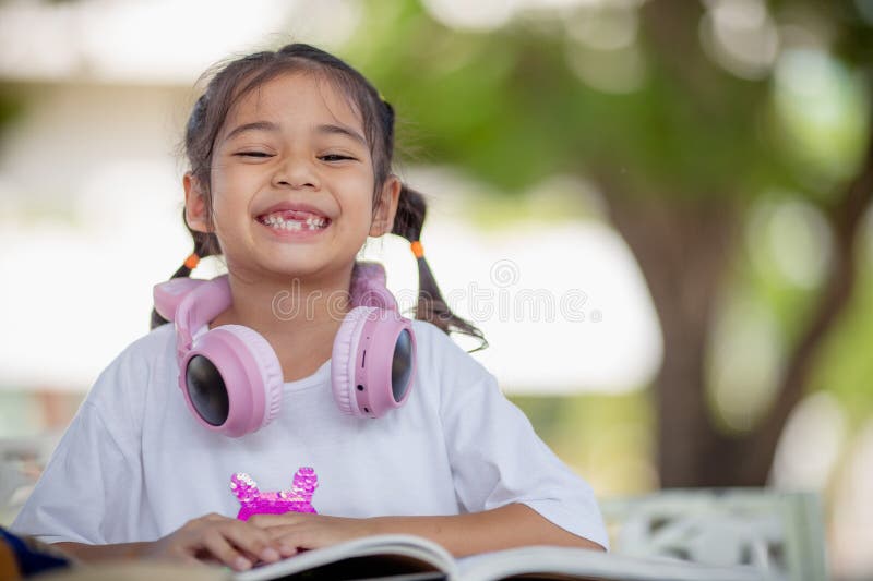 Back To School. Asian Girl Reading a Book Stock Photo - Image of ...