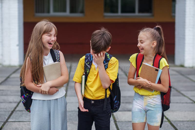 Three School Children Having Fun Outdoors. Classmates with Backpacks ...