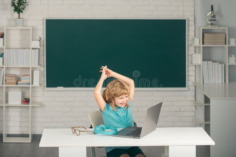 Back To School. Child Boy Using a Laptop Computer at School. Stock ...