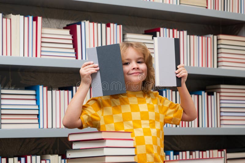 Back To School. Child Reading Book in a Book Store or School Library ...