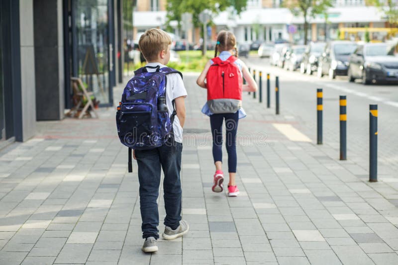 Back To School. Classmates Backpack Behind Back. Children Go To School ...