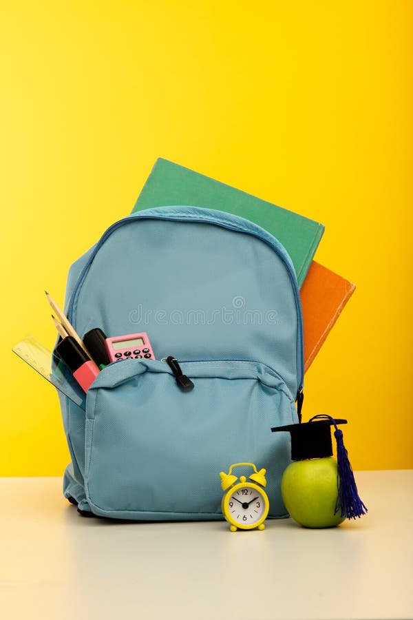 Back To School Concept. Backpack with School Supplies with Alarm Clock ...