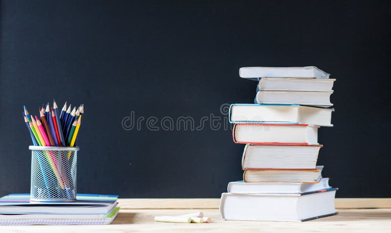 Back To School Concept Pile of Books Against Chalkboard Stock Photo ...